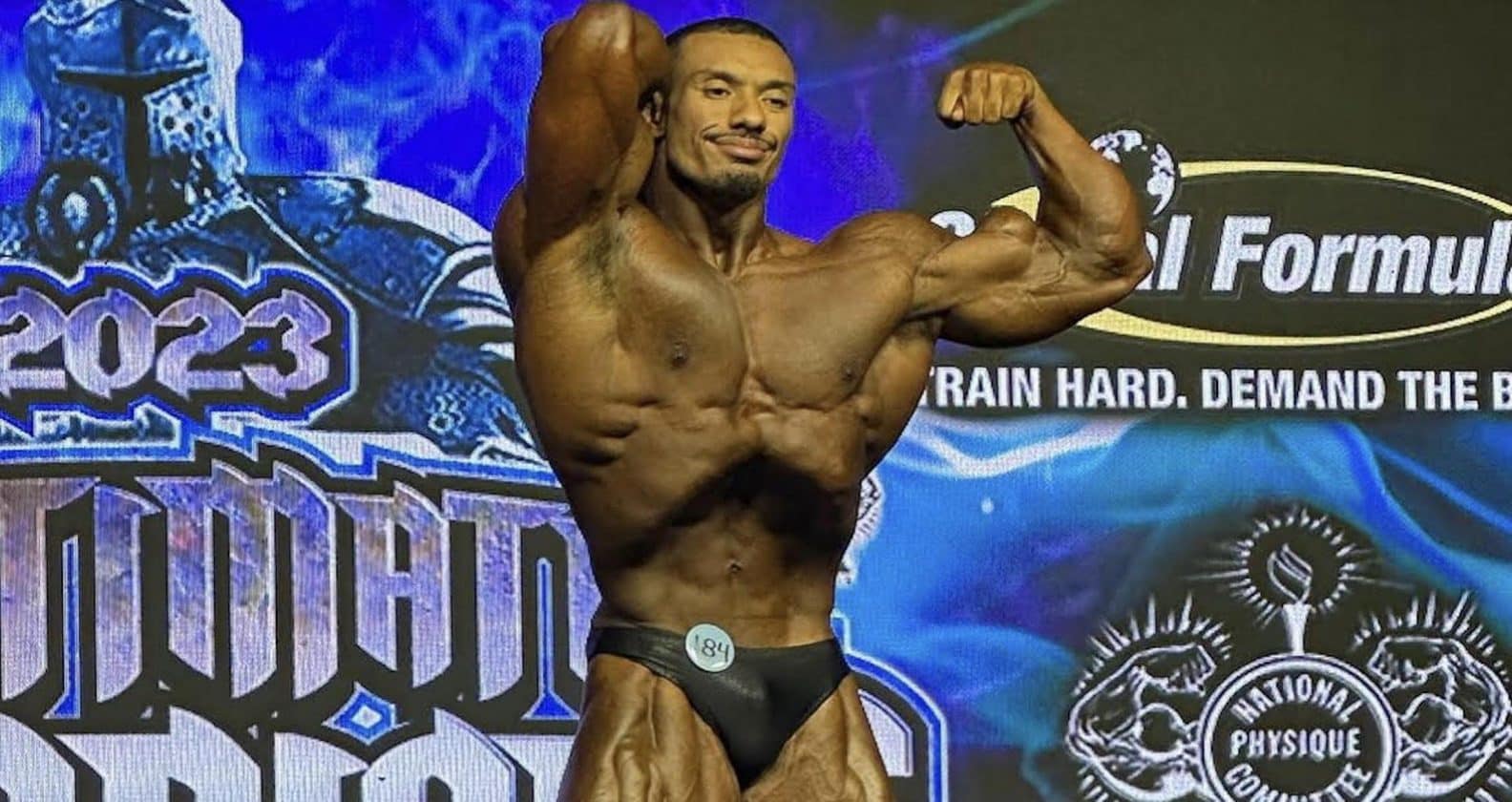 Urs Kalecinski Leads Larry Wheels Through Some Bodybuilding Poses